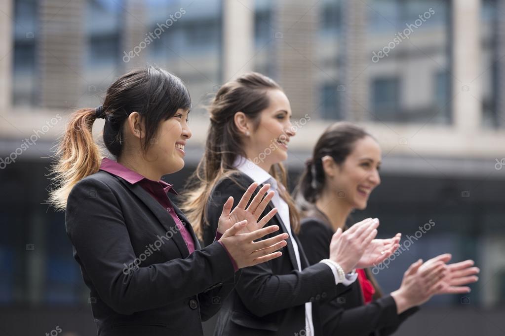 Female executives clapping hands — Stock Photo © sjenner13 #123458394