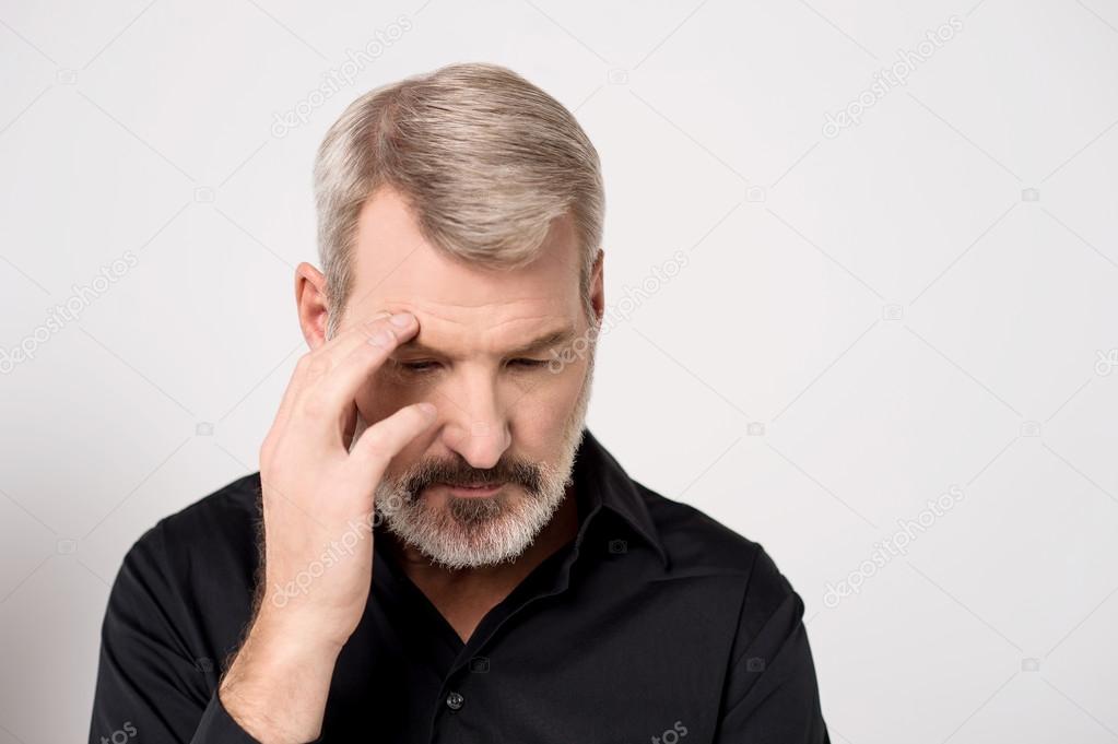 Man holding his head — Stock Photo © stockyimages #62965931