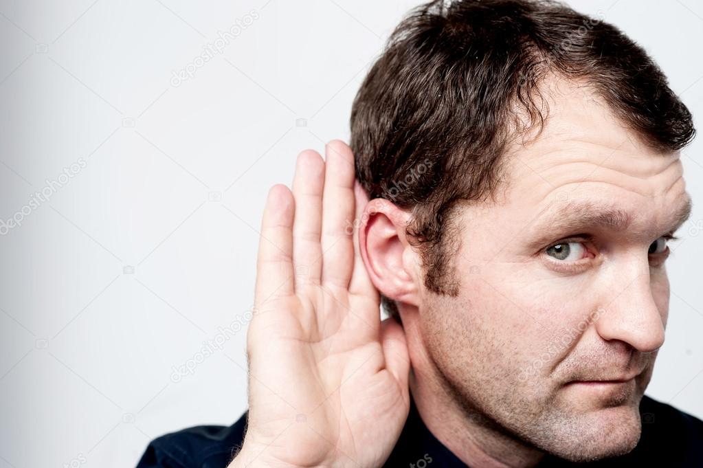 Man secretly listening on conversation — Stock Photo © stockyimages ...