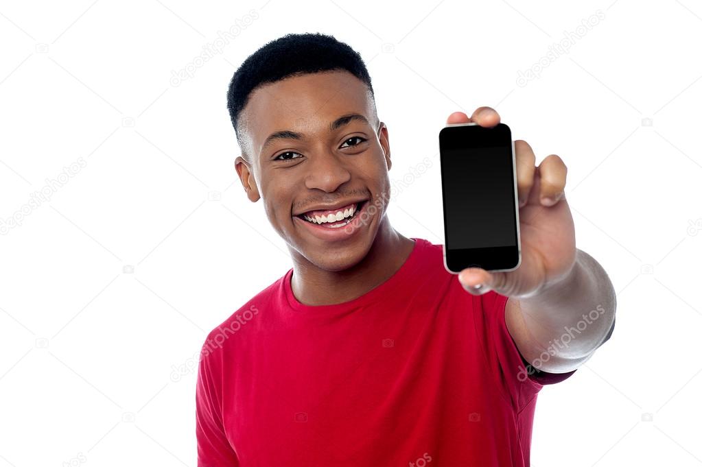 Boy showing smartphone — Stock Photo © stockyimages #84855638