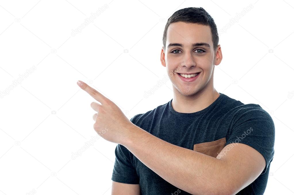 Young boy pointing towards something Stock Photo by ©stockyimages 84855650