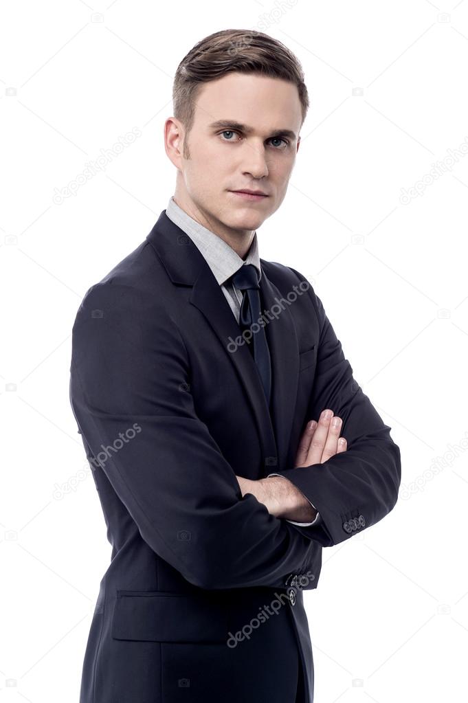 Ambitious businessman posing with arms crossed. Stock Photo by ...