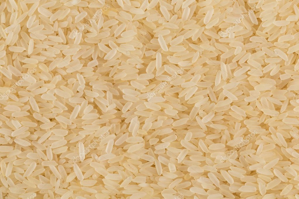 Uncooked rice background — Stock Photo © romantsubin #99297272