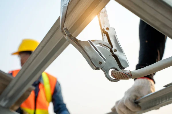 Safety line working at high place,Construction worker wearing safety ...