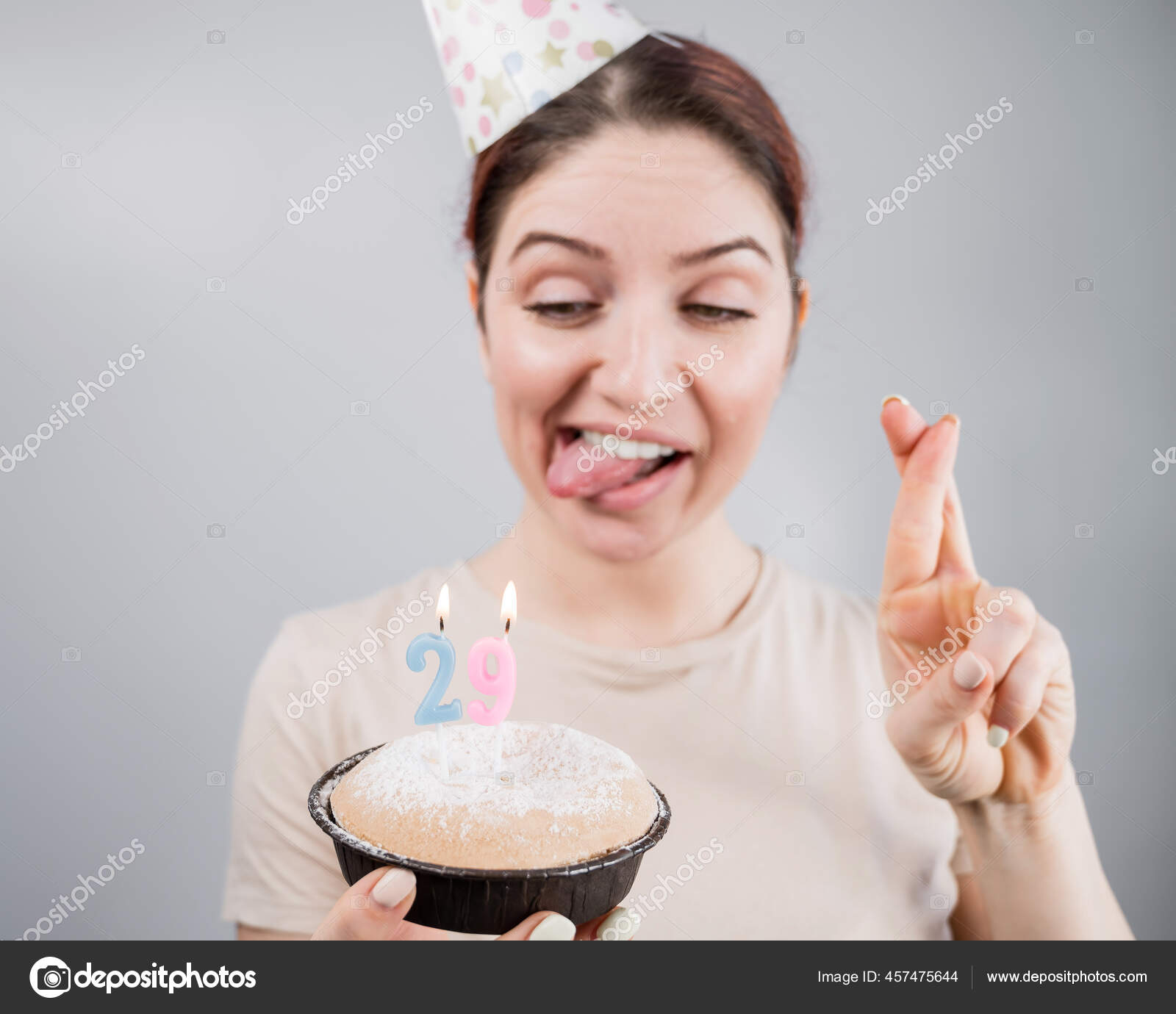 Happy Caucasian Woman Sticking Out Her Tongue And Blowing Out The