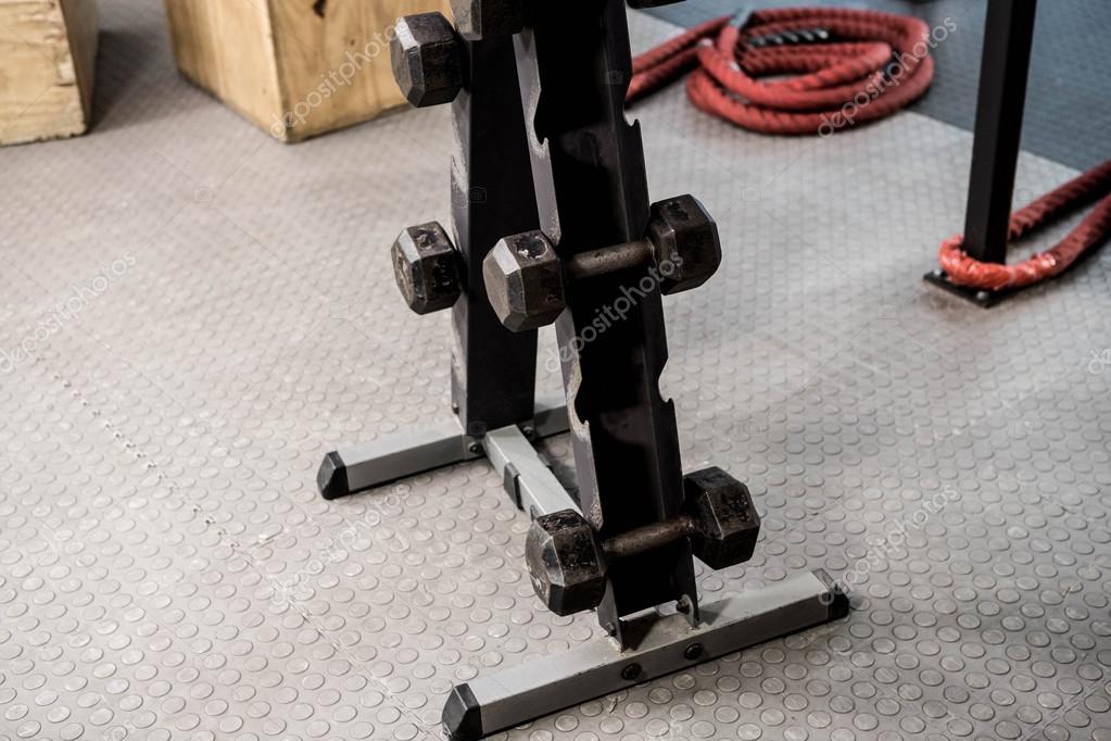 Dumbbell rack at the gym — Stock Photo © Wavebreakmedia #100428270
