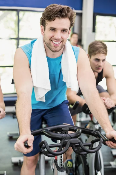People using exercise bike together - Stock Image - Everypixel