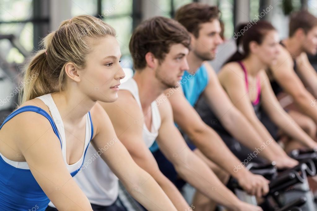 People using exercise bike together Stock Photo by ©Wavebreakmedia ...