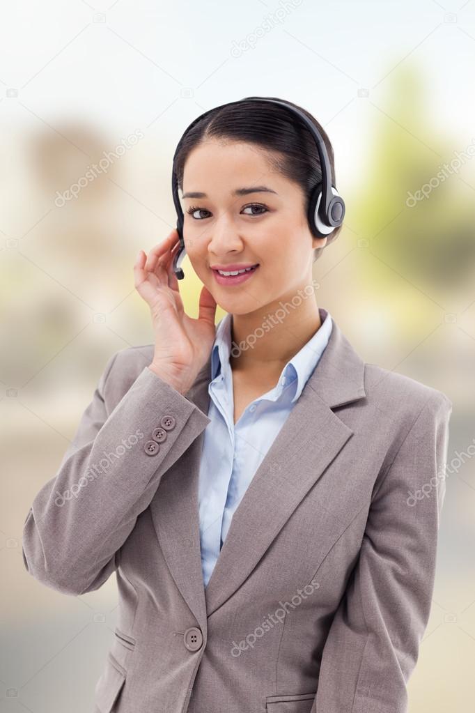 Operator posing with a headset Stock Photo by ©Wavebreakmedia 102221286
