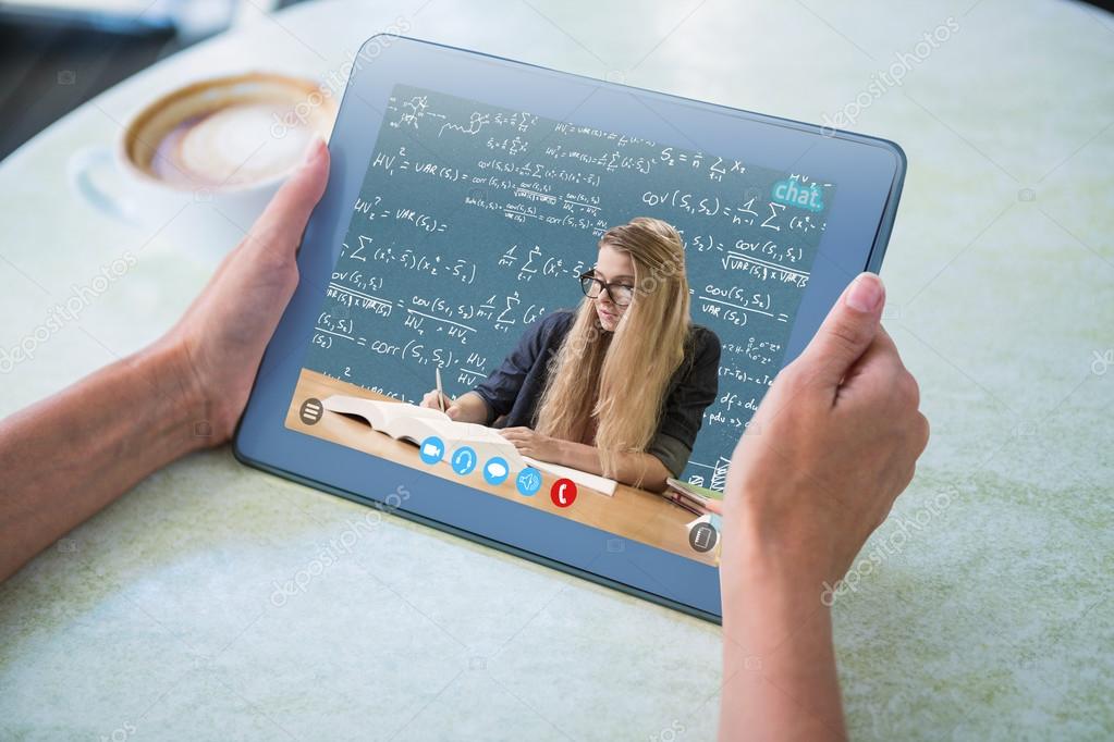 Video chat with student studying in the library Stock Photo by ...