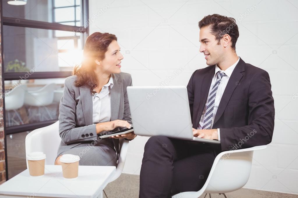 Happy business people using technology — Stock Photo © Wavebreakmedia ...