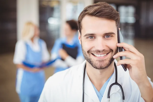 Doctor talking on mobile phone - Stock Image - Everypixel