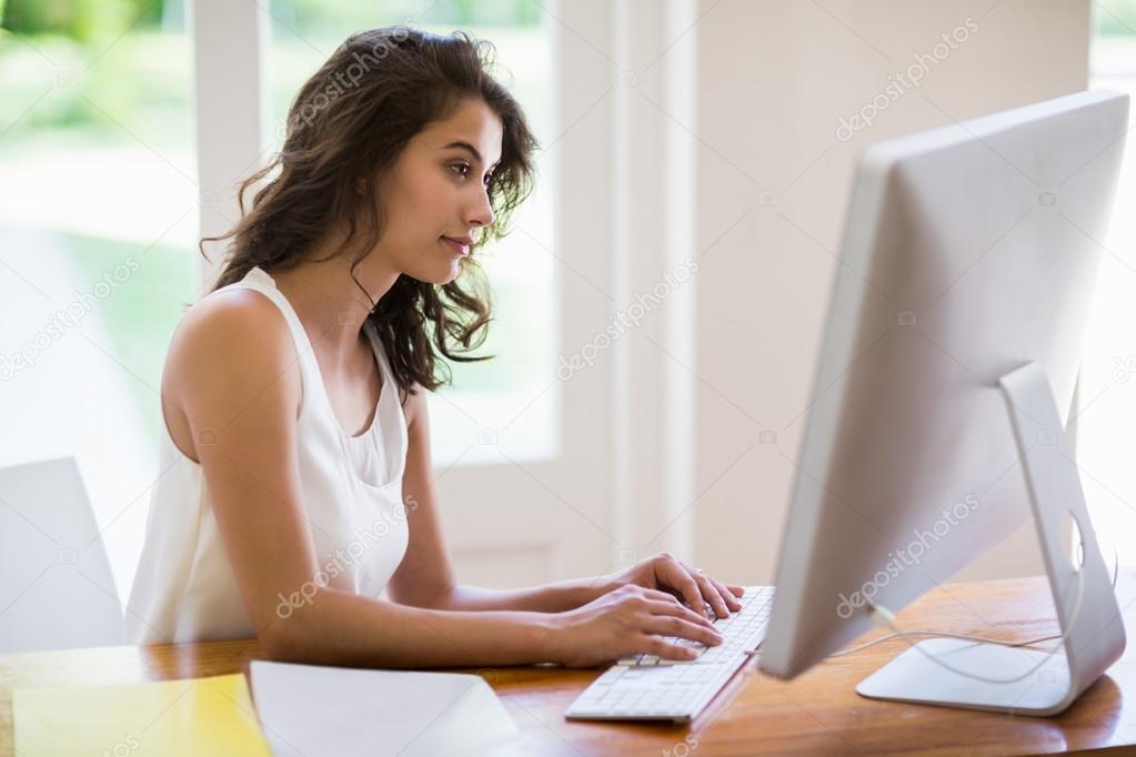 Woman using computer — Stock Photo © Wavebreakmedia #106536062