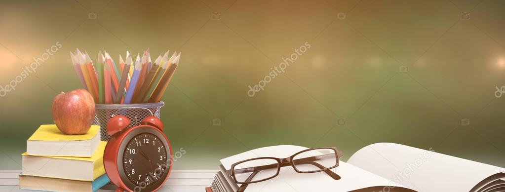 School supplies on desk Stock Photo by ©Wavebreakmedia 106561216