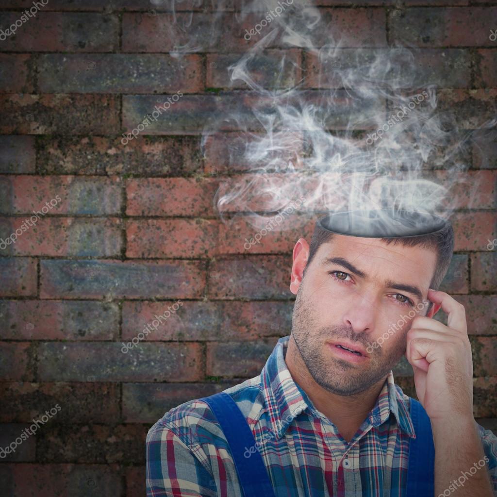 Confused manual worker scratching head Stock Photo by ©Wavebreakmedia ...