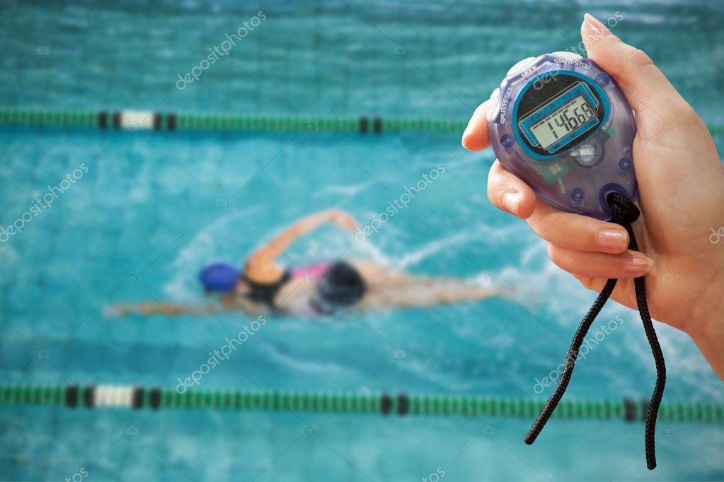 Hand holding a timer Stock Photo by ©Wavebreakmedia 110703578