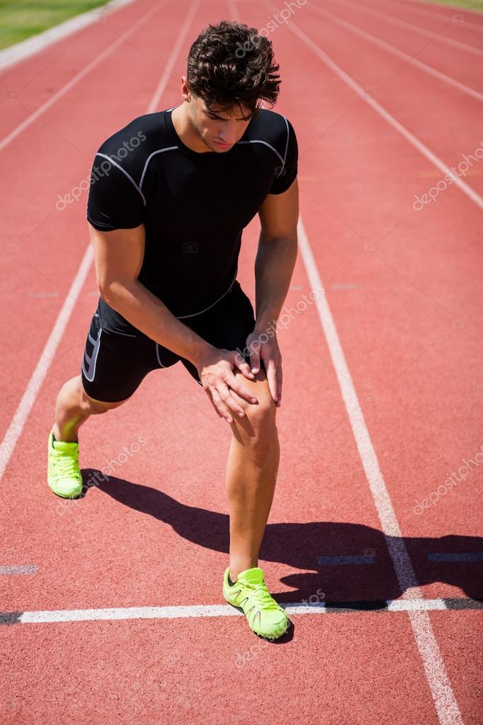 Athlete warming up on running track — Stock Photo © Wavebreakmedia ...