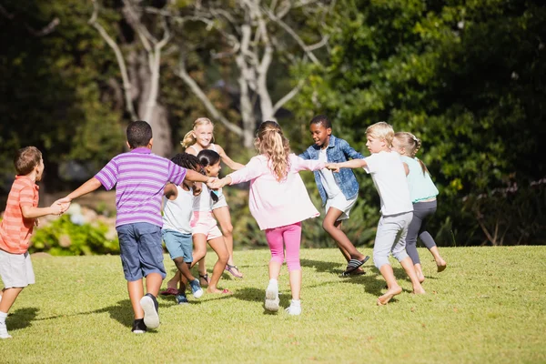 Kids playing together Stock Photo by ©Wavebreakmedia 110796086
