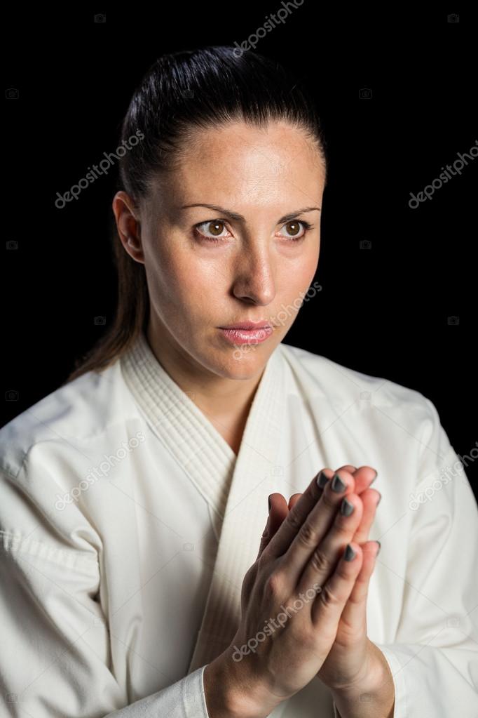 Female karate fighter meditating — Stock Photo © Wavebreakmedia #110803192