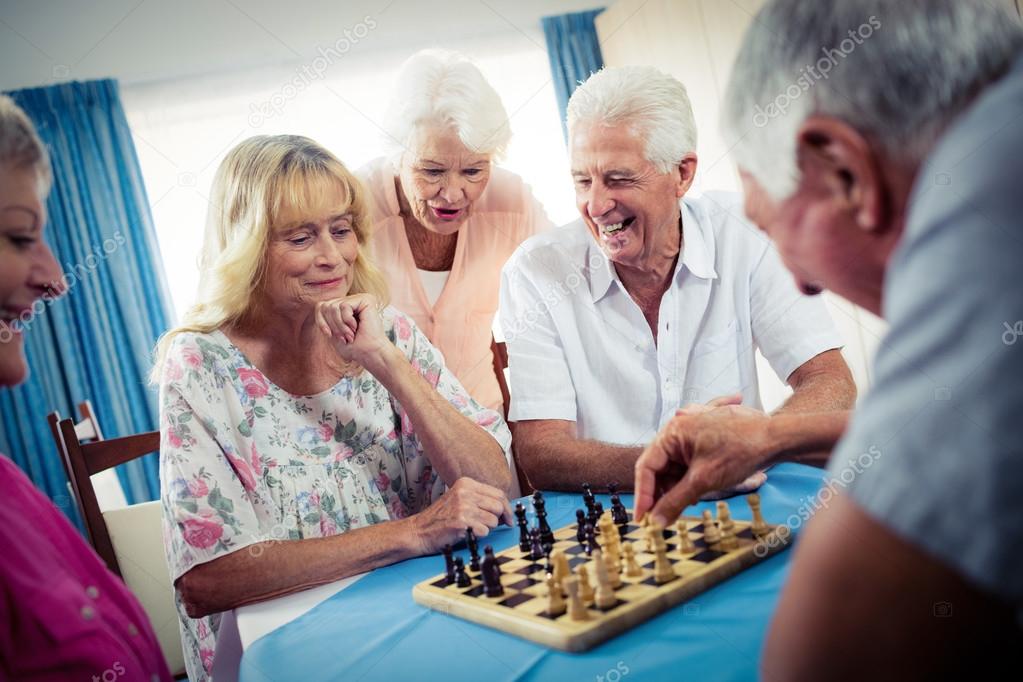 Group of seniors playing chess Stock Photo by ©Wavebreakmedia 110806940