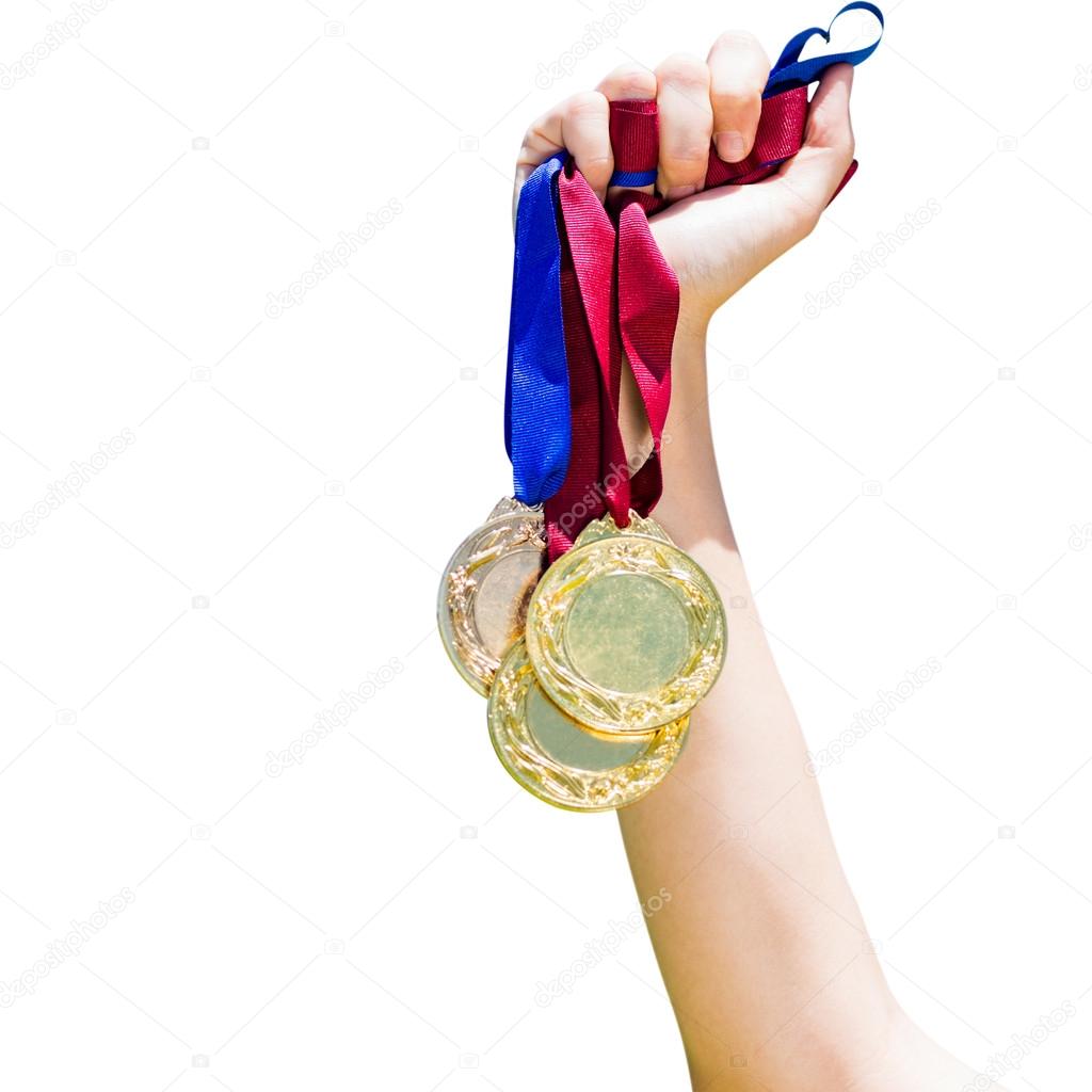 Hand holding three medals Stock Photo by ©Wavebreakmedia 111731056