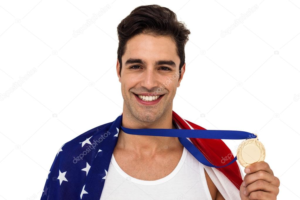 Athlete holding gold medal after victory — Stock Photo © Wavebreakmedia ...