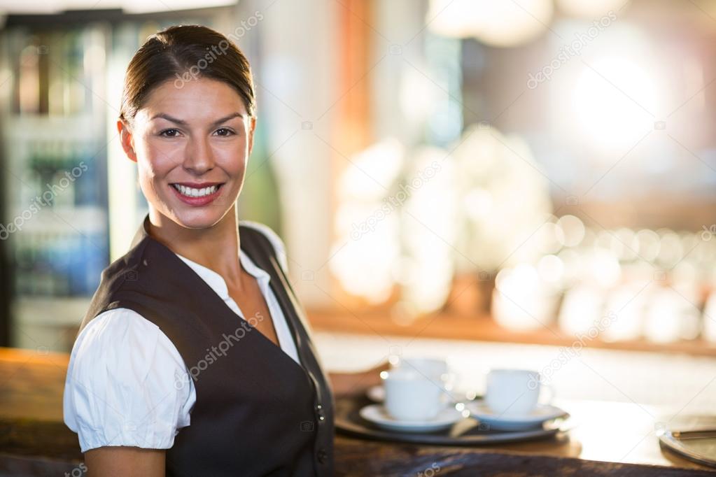 Waitress holding tray with cups Stock Photo by ©Wavebreakmedia 112887078