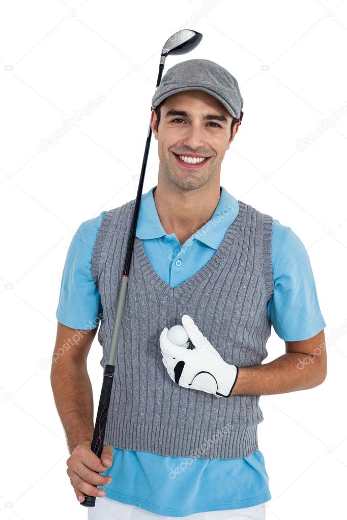 Portrait of golf player standing with golf ball and golf club Stock ...