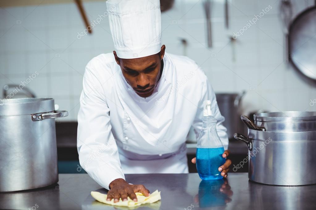 Chef cleaning kitchen counter — Stock Photo © Wavebreakmedia #112926698