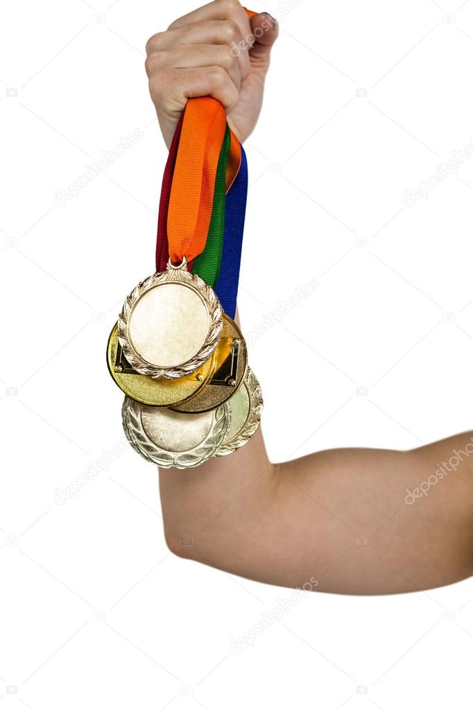 Athlete holding gold medals after victory Stock Photo by ...