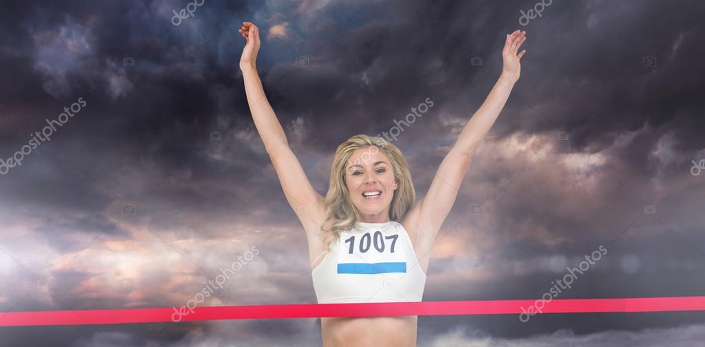 Cheerful winner athlete crossing finish line Stock Photo by ...