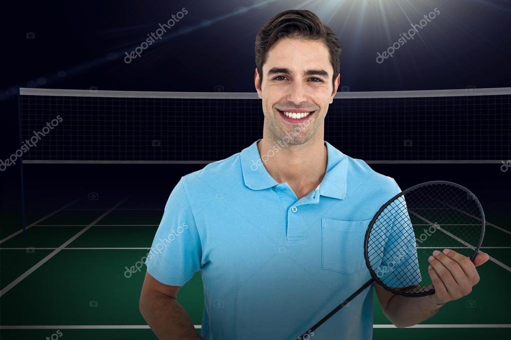 Badminton player holding badminton racket Stock Photo by ...
