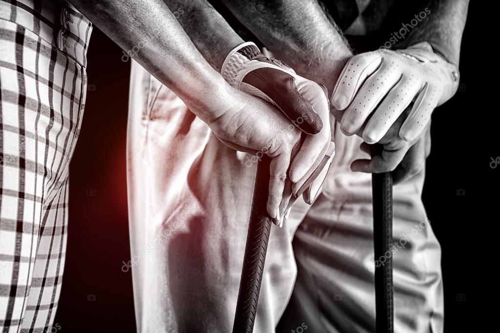 Hands holding golf clubs Stock Photo by ©Wavebreakmedia 113552608