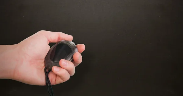 Coach holding stopwatch Stock Photo by ©Wavebreakmedia 113568198