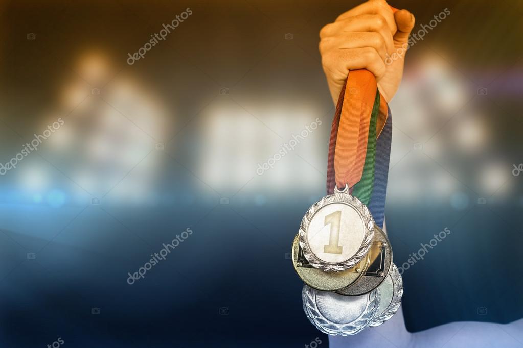 Athlete holding gold medals after victory — Stock Photo ...