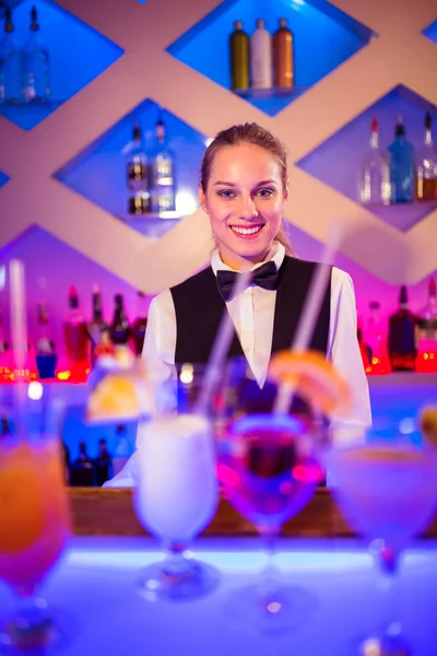 Smiling barmaid standing Stock Photo by ©Wavebreakmedia 114891072
