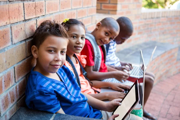 Students using tablet and laptop - Stock Image - Everypixel