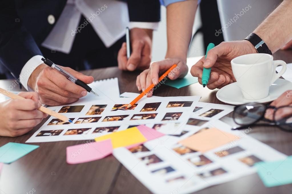 Photo editors with documents — Stock Photo © Wavebreakmedia #114918770