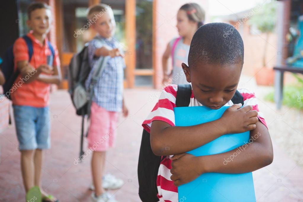 School friends bullying a sad boy in corridor Stock Photo by ...