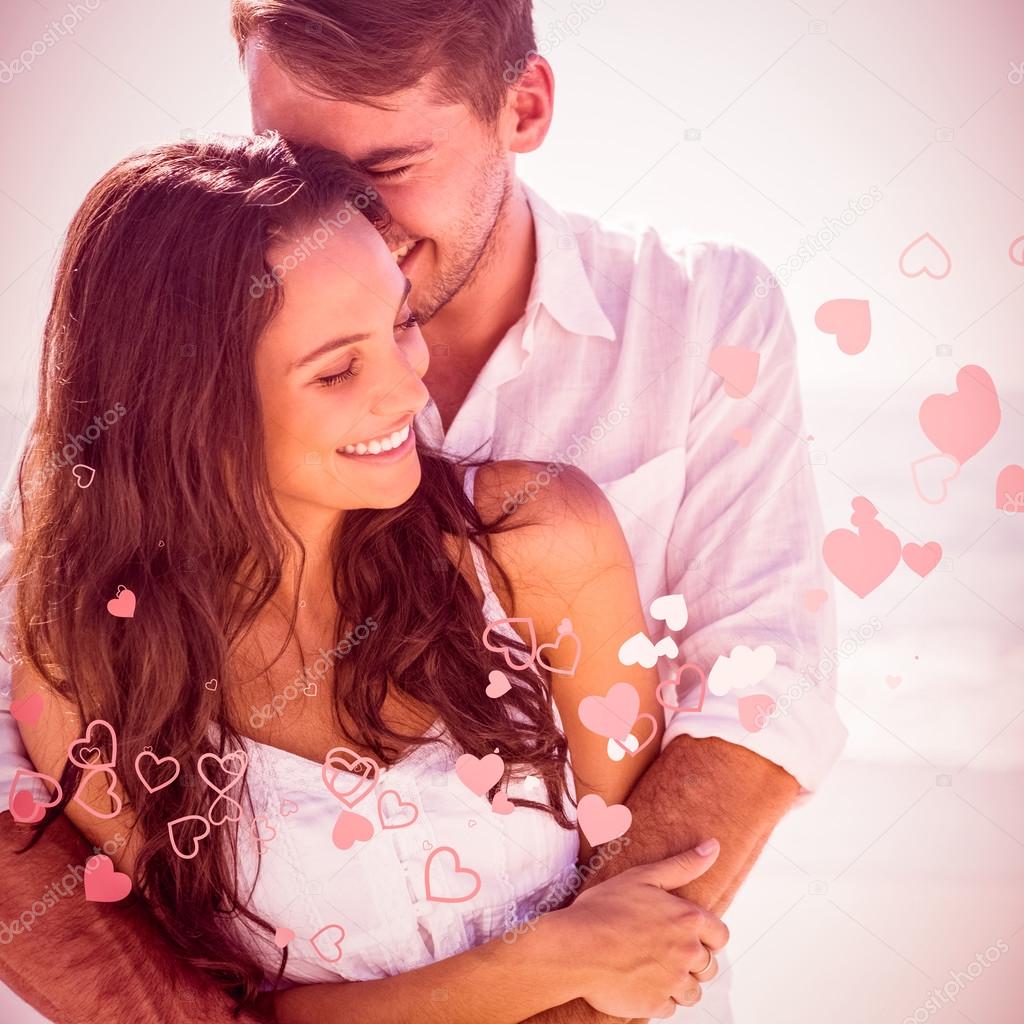 Attractive couple cuddling Stock Photo by ©Wavebreakmedia 120432492