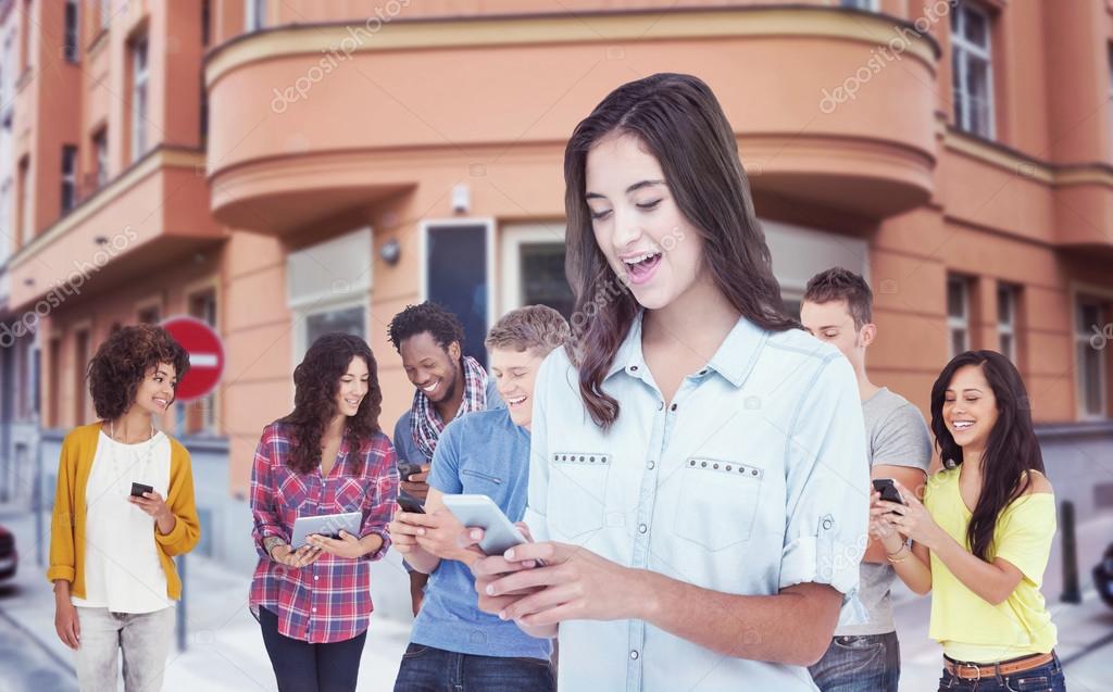 Young people using mobile phones Stock Photo by ©Wavebreakmedia 120432858
