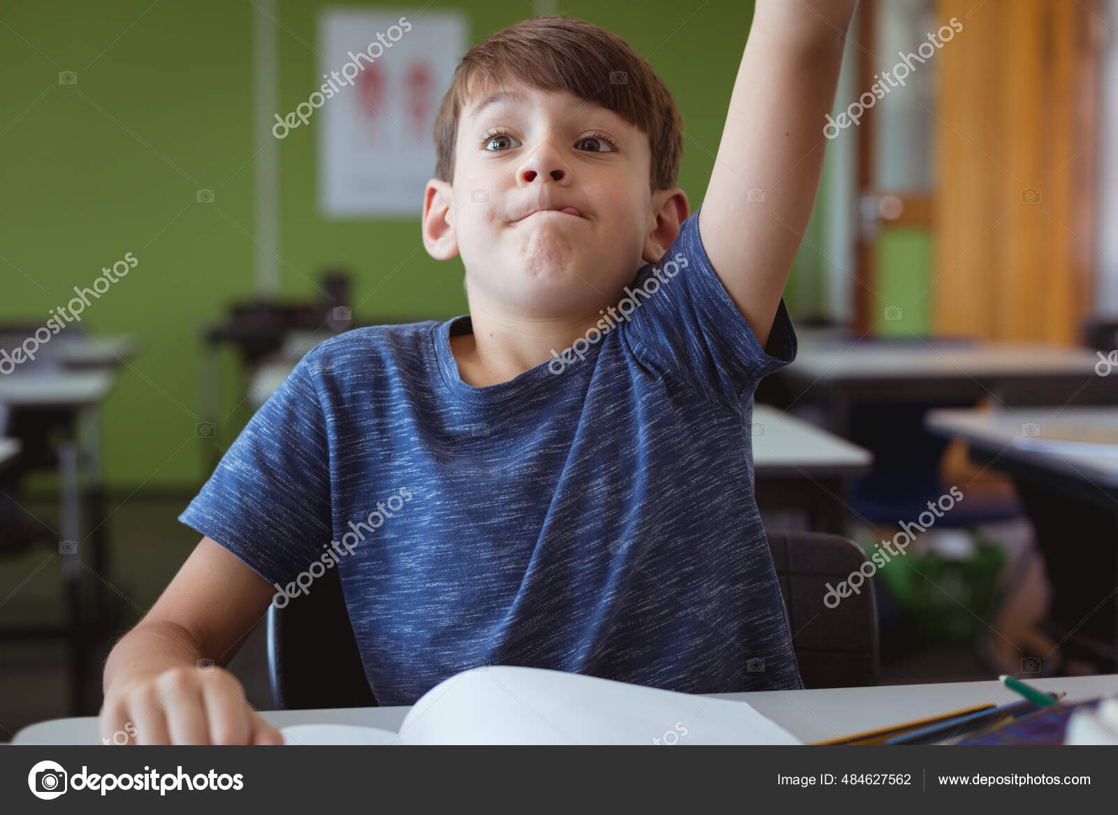 Excited Caucasian Schoolboy Classroom Sitting Desk Raising Hand ...