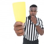 Serious referee showing yellow and red card Stock Photo by ...