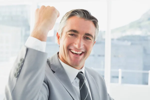 Businessman celebrating a good job — Stock Photo © Wavebreakmedia #53922319