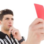 Serious referee showing yellow and red card Stock Photo by ...