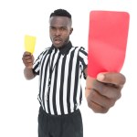 Serious referee showing yellow and red card Stock Photo by ...
