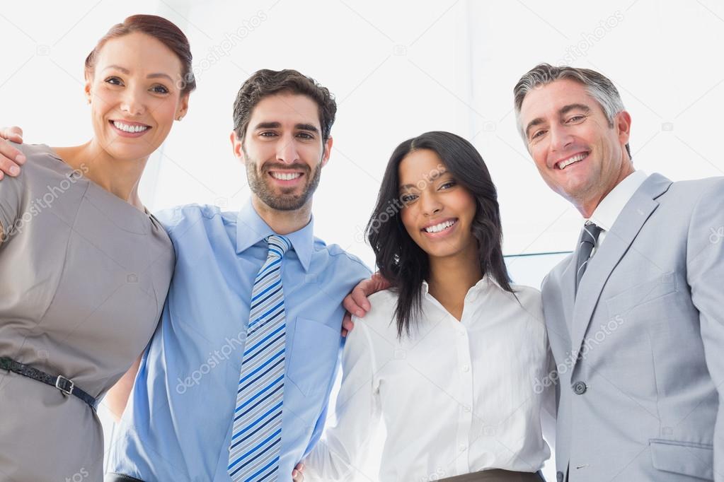 Smiling employee's standing all together — Stock Photo © Wavebreakmedia ...