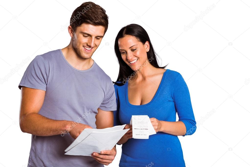 Young couple reading their bills Stock Photo by ©Wavebreakmedia 53923099