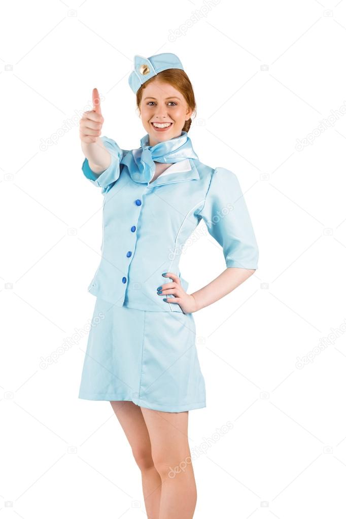 Pretty air hostess with hand on hip Stock Photo by ©Wavebreakmedia 53924509
