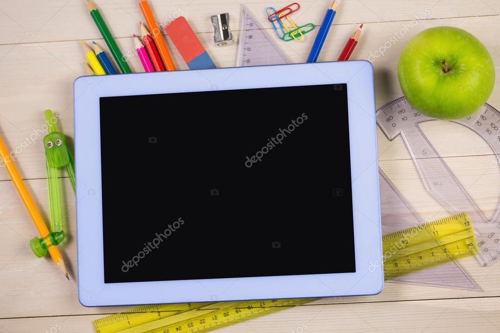 Students table with school supplies Stock Photo by ©Wavebreakmedia 53926377